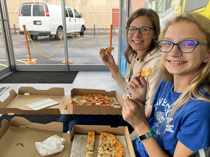 The universal language of pizza joy, spoken fluently by customers who've discovered Toledo's most conversation-worthy slices. The smiles say it all.