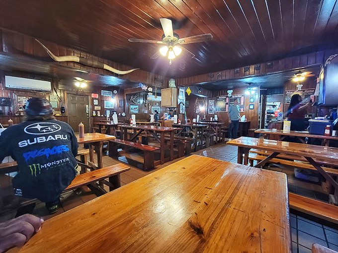 The dining room hums with the satisfied murmurs of regulars and first-timers alike, all united by the universal language of good barbecue.