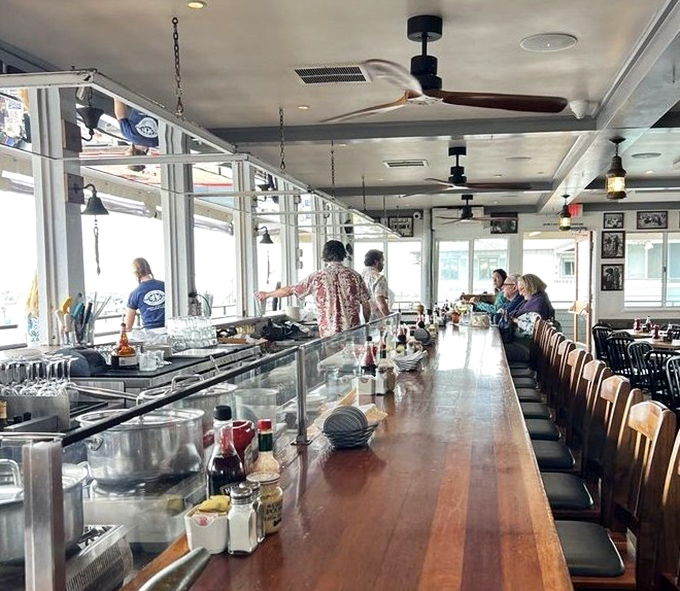 Where strangers become friends over cold beers and hot seafood. This bar has heard more fishing tales than a harbor master&mdash;some of them even true.