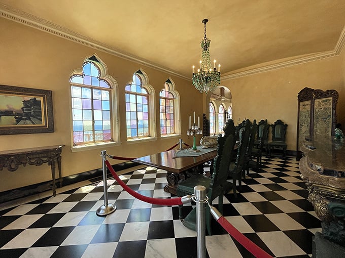 The formal dining room's checkerboard floor and arched windows create the perfect setting for meals that were surely anything but ordinary.