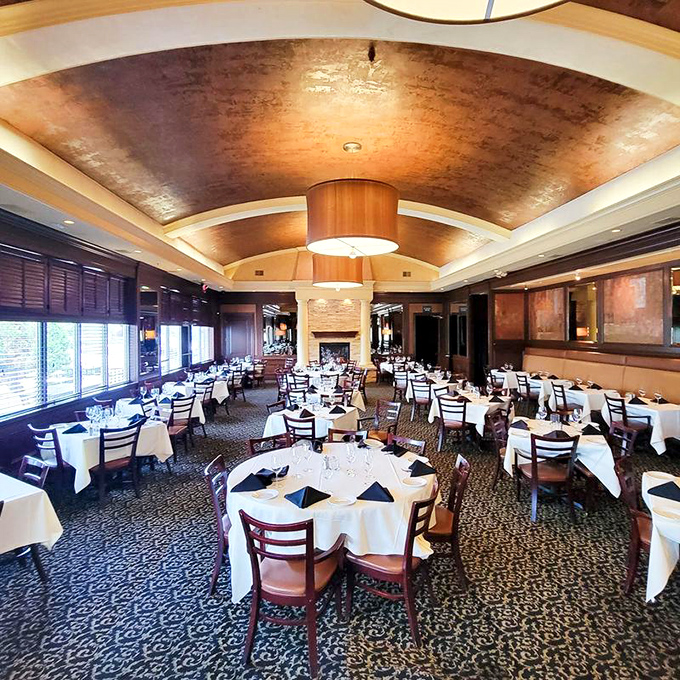 The dining room's copper ceiling and white tablecloths strike that perfect balance between "special occasion" and "Tuesday night treat."