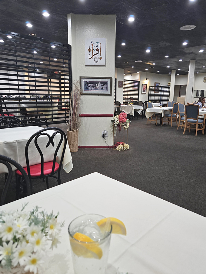 White tablecloths and subtle dividers create dining spaces that say, "Yes, this is a special occasion, even if that occasion is just Tuesday lunch."