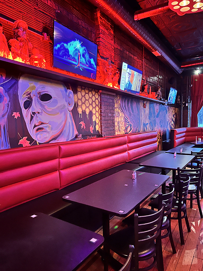 Where horror movie murals watch you eat, turning every meal into dinner theater without intermission.