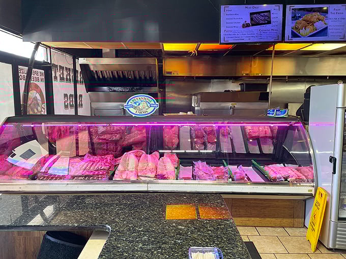 The meat case&mdash;where barbecue dreams begin and diets go to die. That pink-tinged display light is nature's way of saying "resistance is futile."