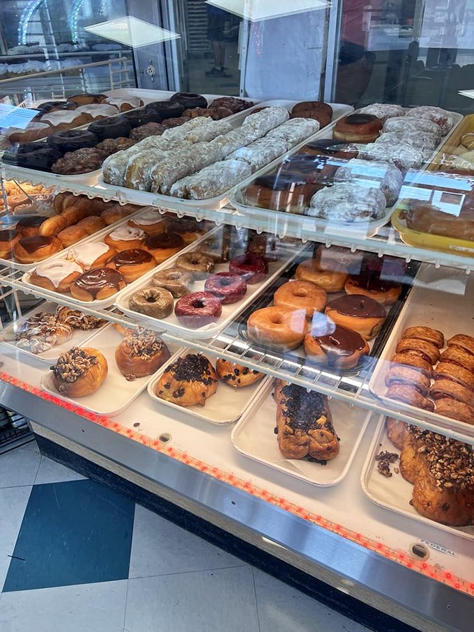 The donut display that makes grown adults press their noses against the glass like 8-year-olds. Resistance is futile.