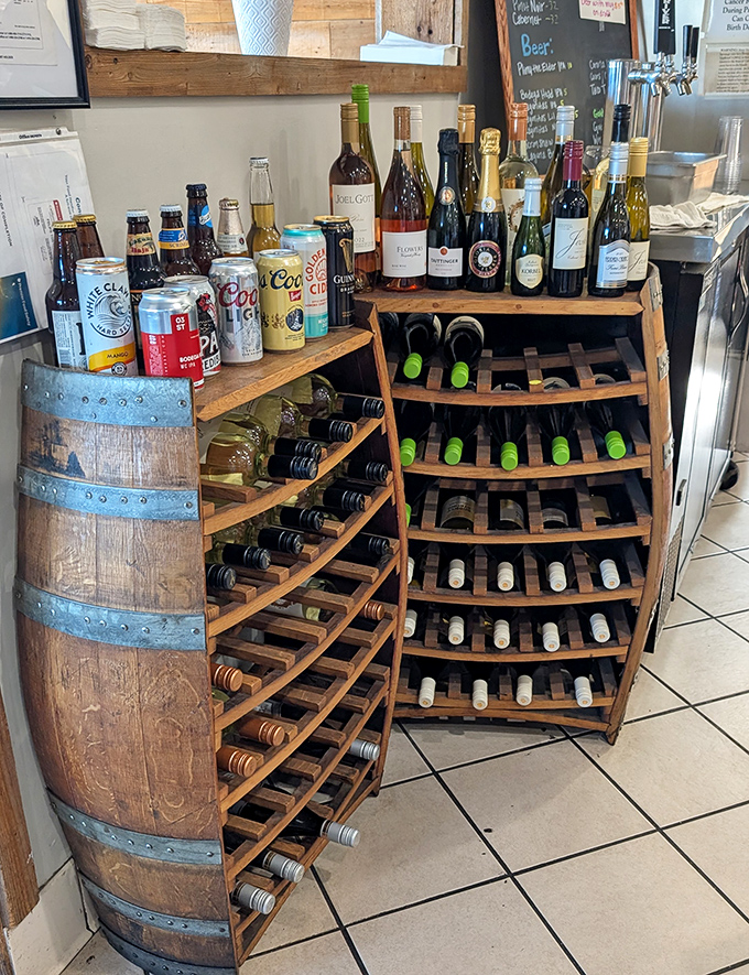 The wine and beer selection proves this place understands that great seafood deserves worthy liquid companions. That barrel display? Pure coastal charm without trying too hard.