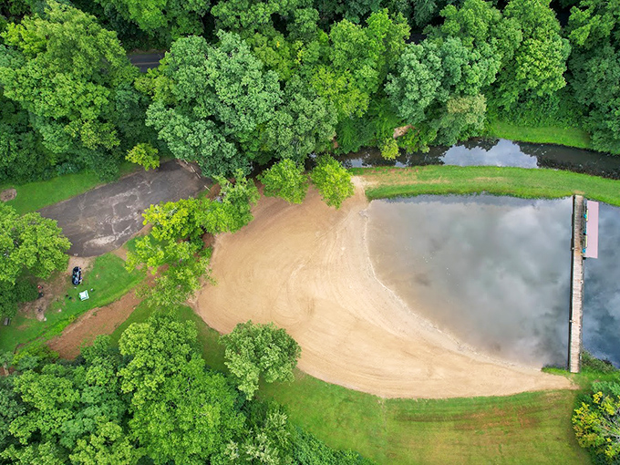 Bird's eye brilliance reveals Pine Lake's beach. From above, the park's swimming area looks like nature's perfect infinity pool nestled in an emerald setting. 