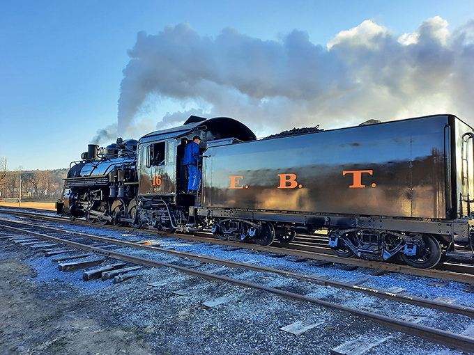 Steam billowing dramatically as No. 16 prepares for departure. Movie directors spend millions trying to create moments this authentically atmospheric.