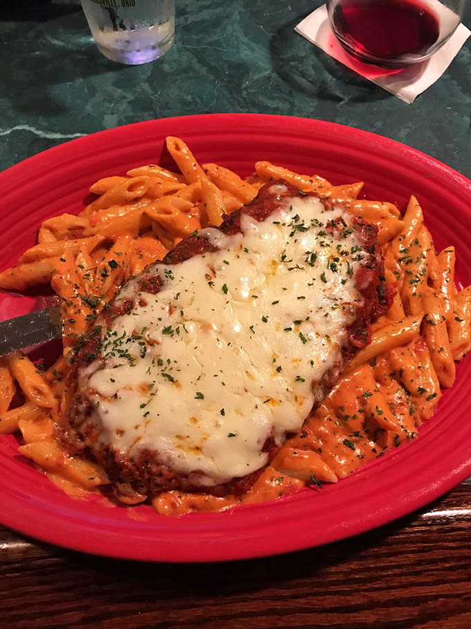 Eggplant parmigiana that doesn't just sit on the plate&mdash;it commands attention with its melty cheese crown and throne of penne in vodka sauce.