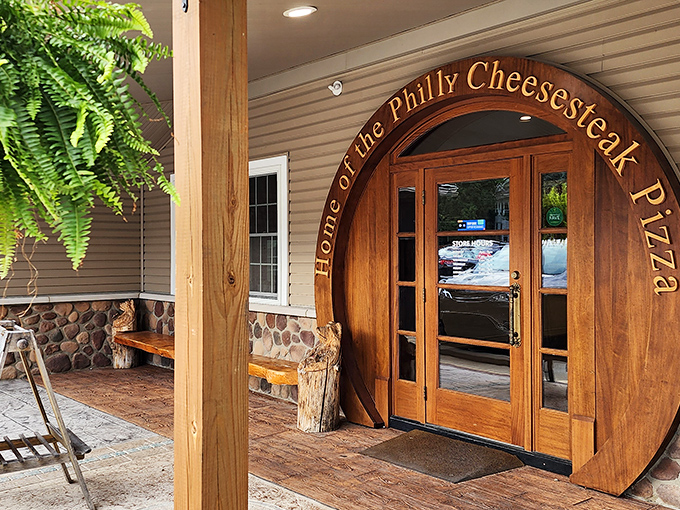 "Home of the Philly Cheesesteak Pizza" isn't just a slogan&mdash;it's a wooden archway inviting you into flavor paradise.