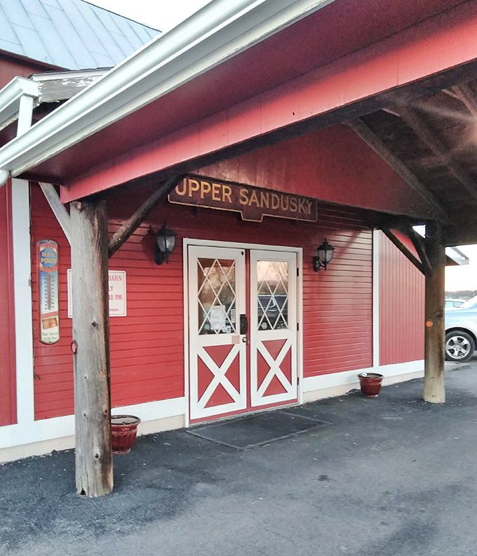 The barn-style entrance with its charming "X" doors practically whispers, "Come on in, the meat is fine."