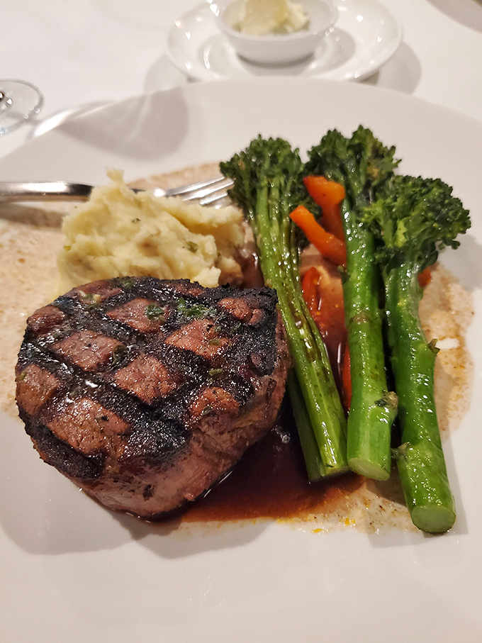 A filet mignon so perfectly grilled it could convert dedicated pescatarians back to their carnivorous roots temporarily.