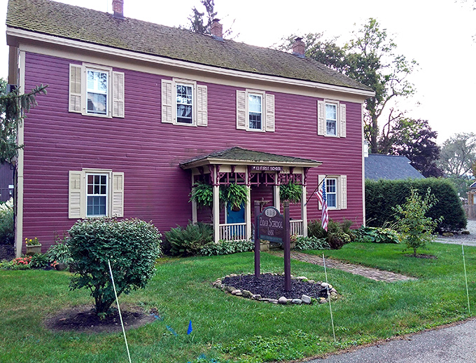 11. first schoThis vibrant purple building isn't having a midlife crisis—it's confidently showcasing the kind of bold color choice that makes modern HOAs break out in hives.ol in historic zoar village