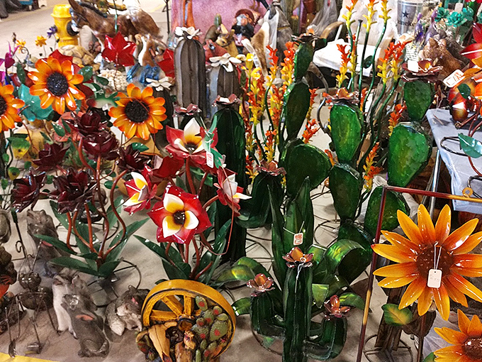 Metal garden art blooms eternally in this corner of the market—flowers and cacti that never need watering, perfect for desert living.