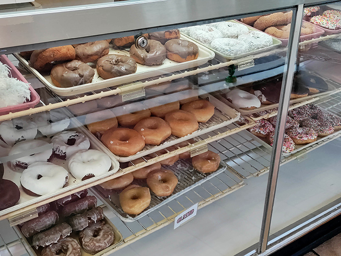 A glimpse into donut heaven, where trays of freshly made creations await their destiny. The hardest life decision: glazed, filled, or frosted?