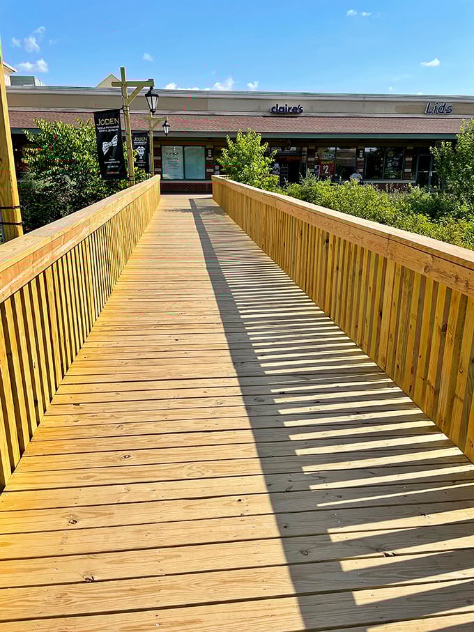 This wooden footbridge doesn't just connect stores&mdash;it's the pathway to retail therapy your therapist never prescribed.