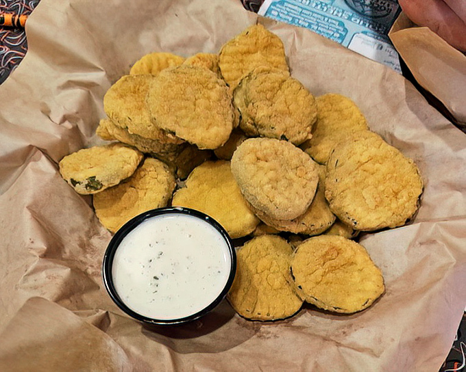 These golden fried pickles aren't just appetizers&mdash;they're crunchy little discs of joy served with a side of nostalgia.