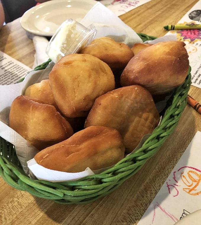Fried biscuits that puff with pride, nestled in their basket like golden pillows waiting to meet their apple butter soulmate.