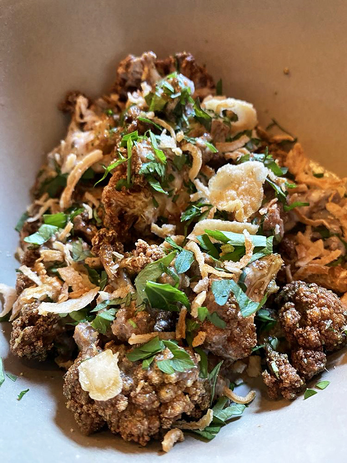 Fried cauliflower elevated to art form &ndash; crispy, herbaceous, and making you wonder why you ever boiled vegetables in the first place.