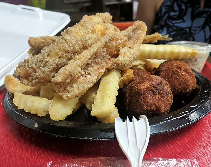 Fried fish that's crispy enough to make Neptune jealous, with hush puppies standing by for backup. Southern seafood perfection.