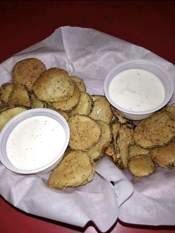 Fried pickles with ranch dipping sauce—the South's contribution to world peace, one crunchy bite at a time.