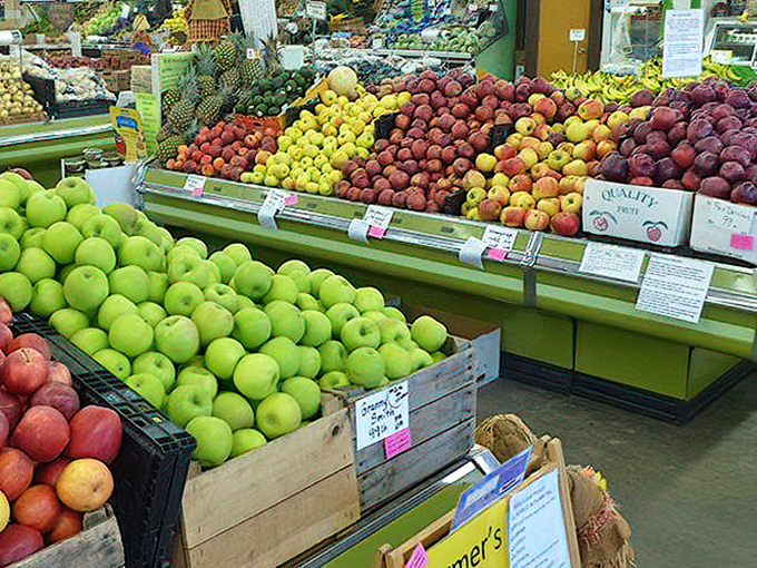 Nature's candy store, where apples and peaches compete for your attention like contestants on a particularly delicious reality show.
