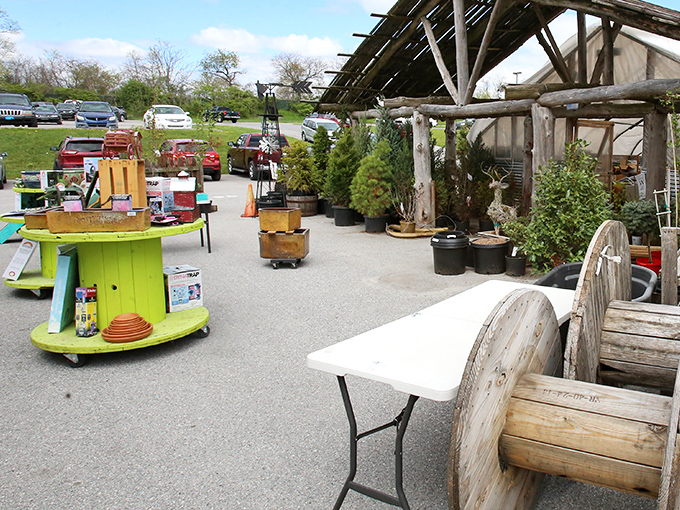Garden treasures await green thumbs. That repurposed cable spool makes a charming outdoor table&mdash;someone's Pinterest dream ready for the taking.