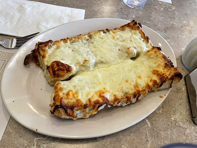 Garlic cheese bread that makes first dates dangerous and return visits mandatory&mdash;the perfect balance of crisp exterior and pillowy inside.