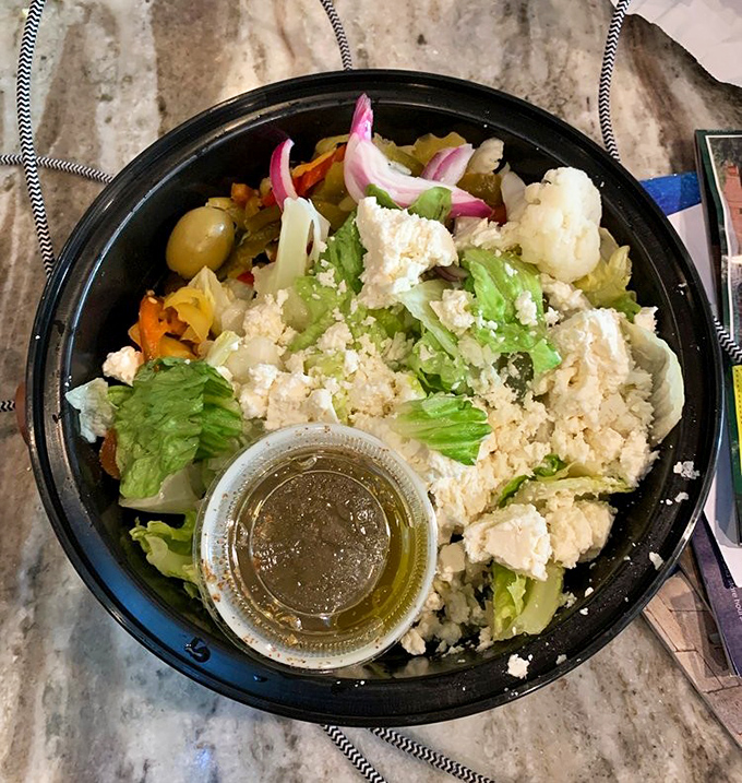 A Greek salad that doesn't feel like punishment. Feta, olives, and fresh vegetables provide a moment of virtue before returning to pizza.