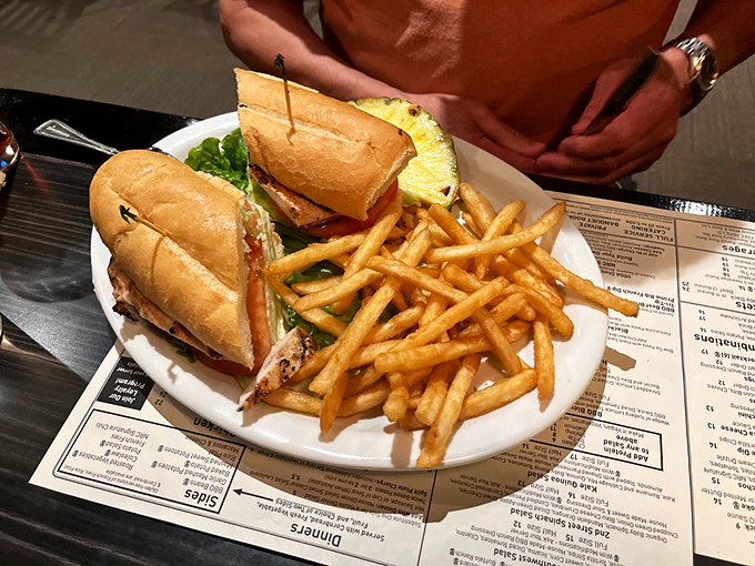 Sandwiches stacked so high they need their own zip code. The fries are just along for the delicious ride.