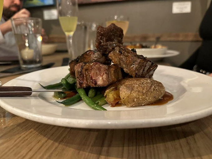 Lamb chops cooked to pink perfection, proving that sometimes the simplest preparations let truly great ingredients sing their own delicious song.