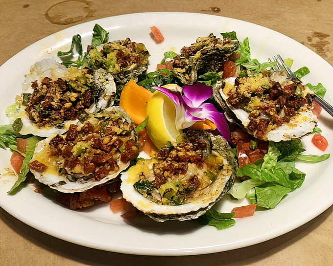Grilled oysters dressed up fancy, proving that sometimes the best things come in shells with attitude.