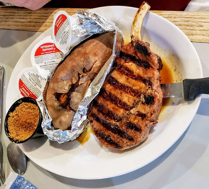 This grilled pork chop with perfect sear marks sits proudly next to its sweet potato companion. A partnership as perfect as Astaire and Rogers.