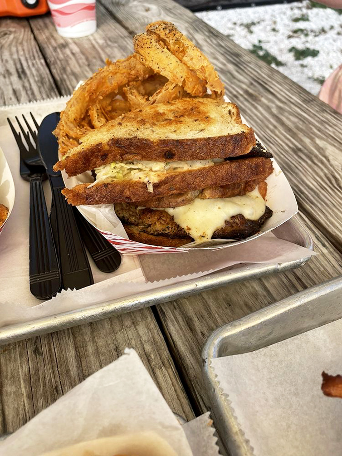 The grouper Reuben towers like a delicious skyscraper built by someone who understands portion control is optional.