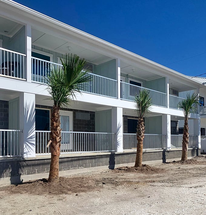 Freshly planted palms frame this newly rebuilt beachfront accommodation. Post-hurricane resilience with a view worth waiting for.