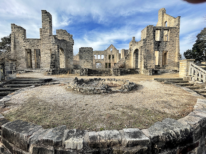 Inside the castle ruins, where dreams of Midwest royalty met Missouri reality. The stone walls frame perfect portraits of what might have been.