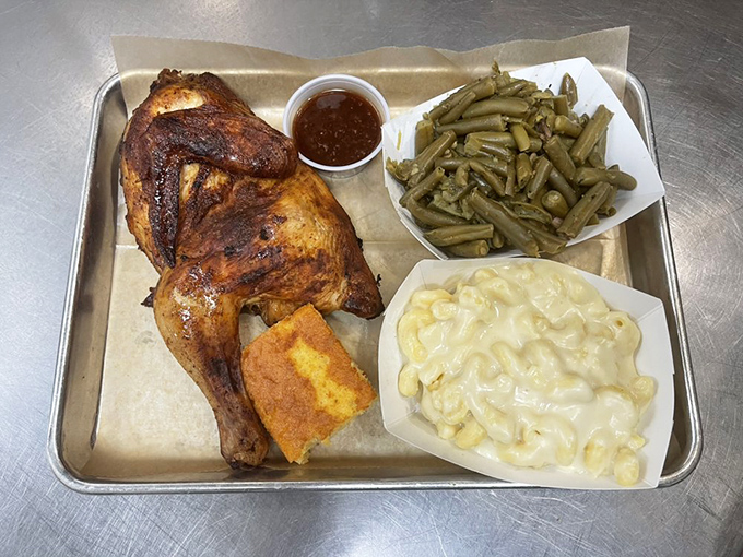 Half chicken with that mahogany skin that whispers of hours in the smoker, alongside creamy mac and green beans.