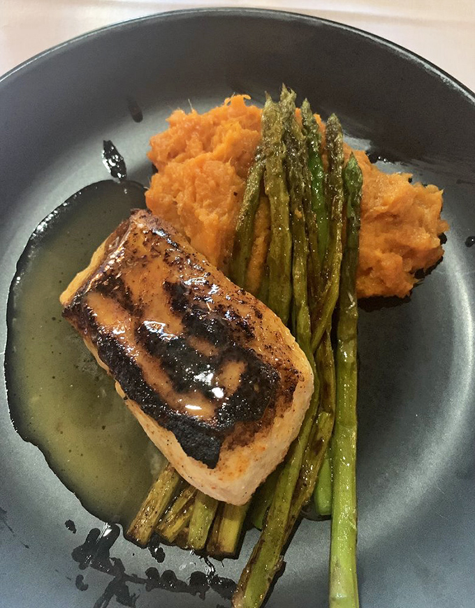 Halibut that's dressed for success with a perfect sear, resting on a bed of sweet potato pur&eacute;e. Even the asparagus looks like it's having a good day.