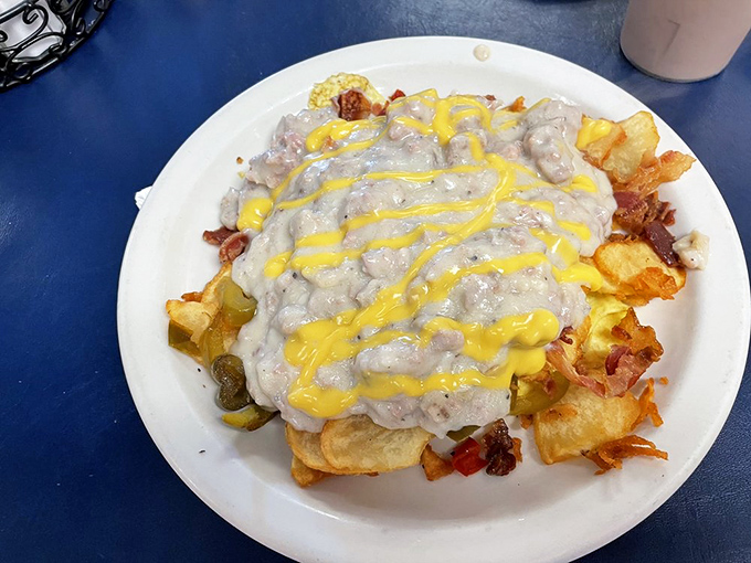 The "Hay Stack" lives up to its name&mdash;a mountain of breakfast favorites smothered in country gravy with cheese standing in for sunshine.