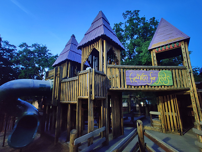 Heaven For Kids playground delivers on its name with wooden towers that make modern plastic play structures look like sad airport waiting areas.