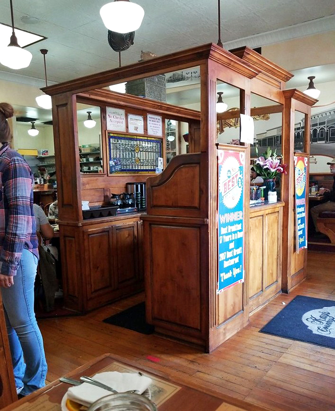 The host station doubles as a time machine to when restaurants had character instead of concepts. That wooden craftsmanship has welcomed more hungry souls than a highway diner.