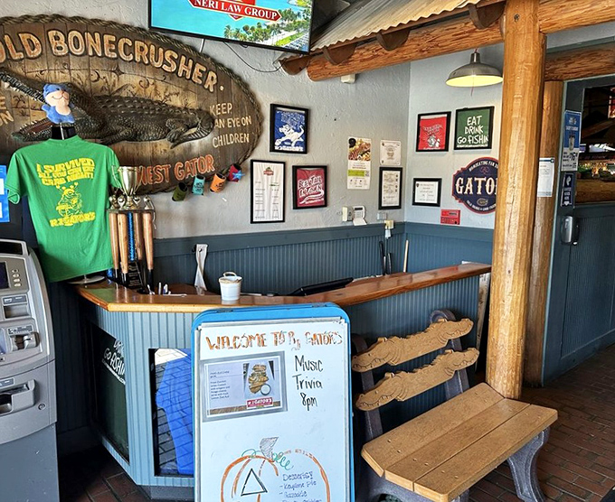 The host station welcomes you with rustic charm and a wooden alligator that's seen more happy diners than a mall food court on Black Friday.