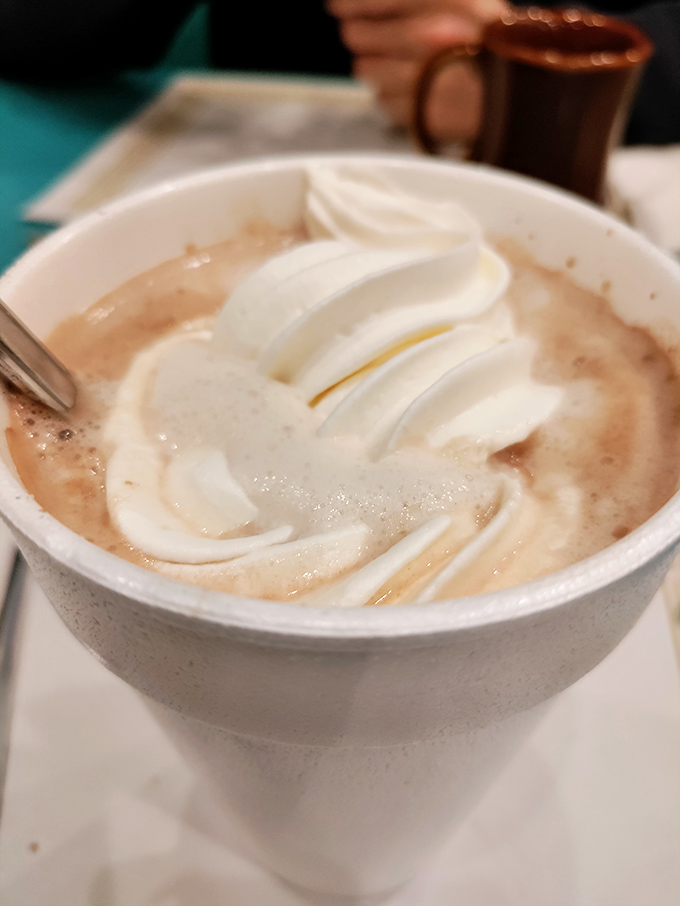 Hot chocolate crowned with a swirl of whipped cream&mdash;winter's perfect companion and proof that simple pleasures are often the most satisfying.