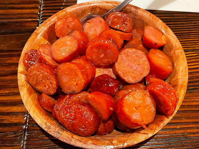 These hot links glisten with promise, their caramelized exterior hiding spices that will make your taste buds stand up and salute.