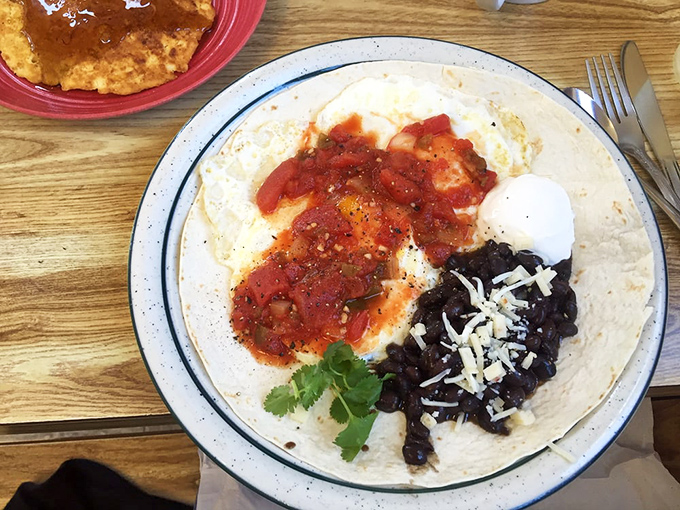 Huevos Rancheros that bring the fiesta! Bright salsa, black beans, and melty cheese create a breakfast worth crossing state lines for.
