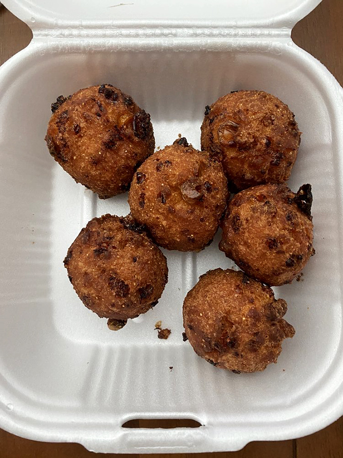 Hushpuppies that somehow manage to be both crispy and tender—little golden orbs of cornmeal joy waiting for their moment in the spotlight.
