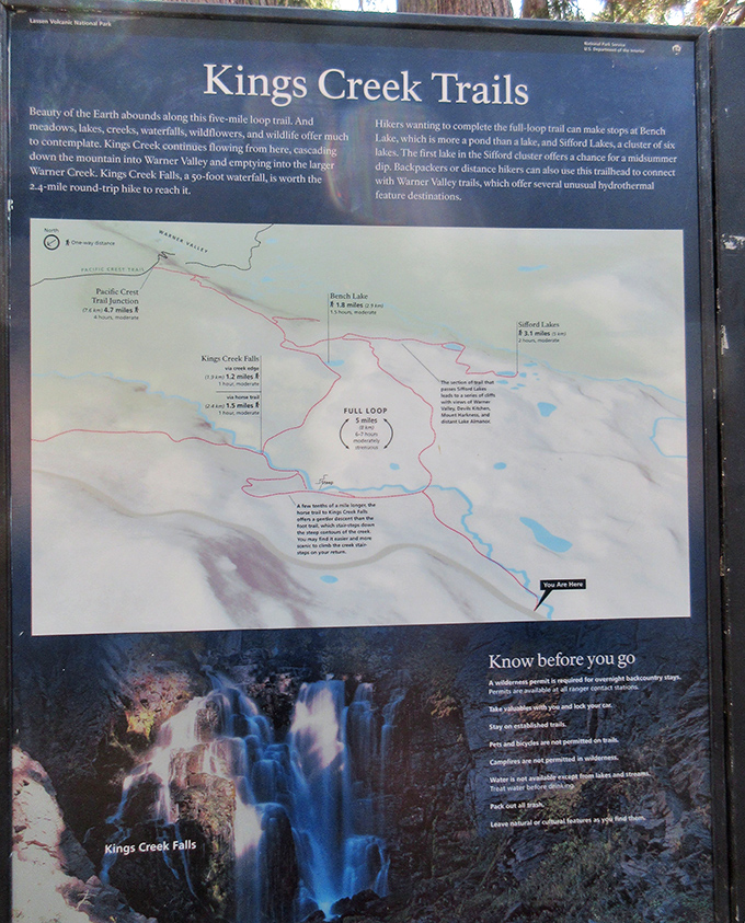 The trail map reveals Kings Creek Falls is just one highlight in a park filled with volcanic wonders and alpine beauty.