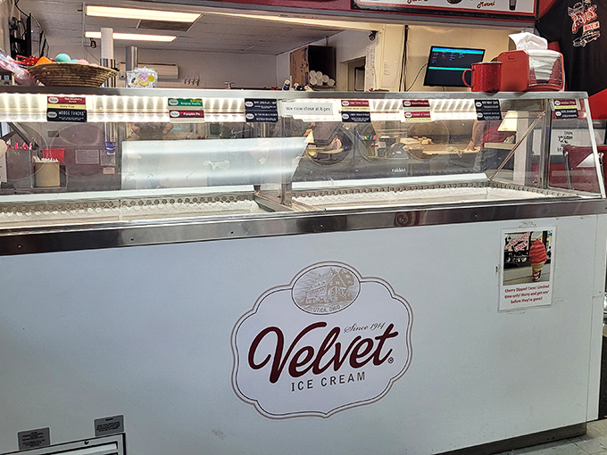 The ice cream counter promises cold comfort in a warm world, with Velvet Ice Cream standing ready to solve whatever problem you're currently facing.