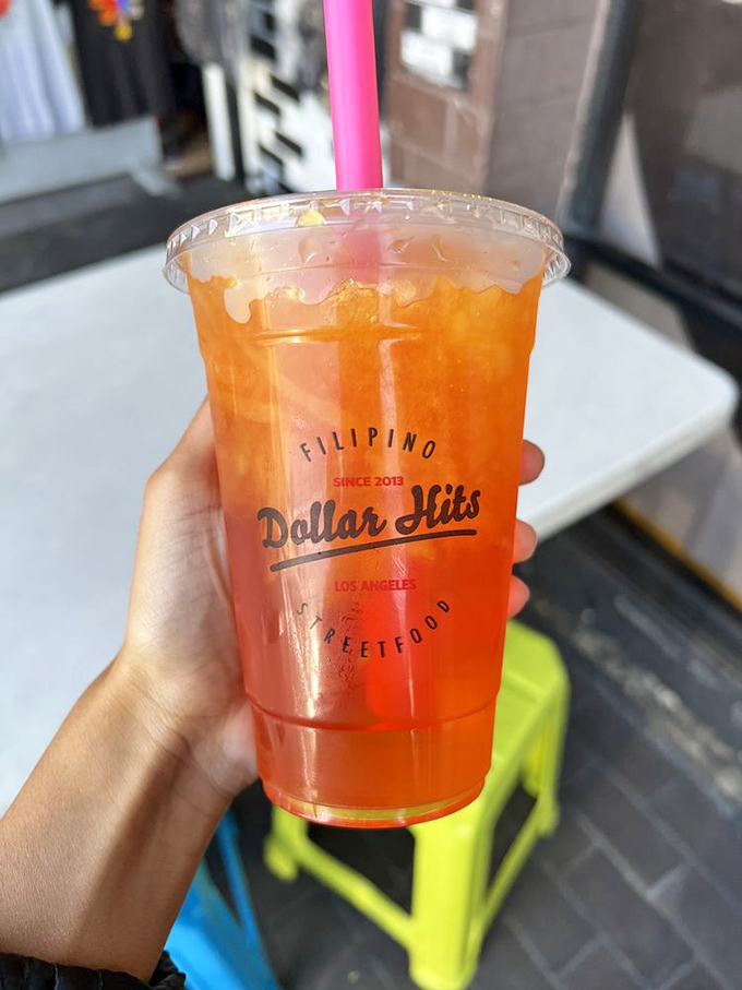 This isn't just fruit juice &ndash; it's liquid sunshine in a cup, complete with the Dollar Hits logo to remind you where this flavor revelation happened.