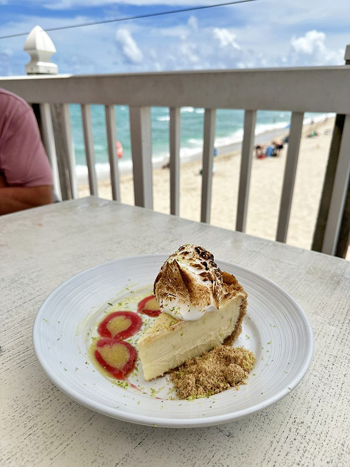 Key lime pie with a toasted meringue hat—Florida's official dessert showing off against a backdrop of actual Florida.